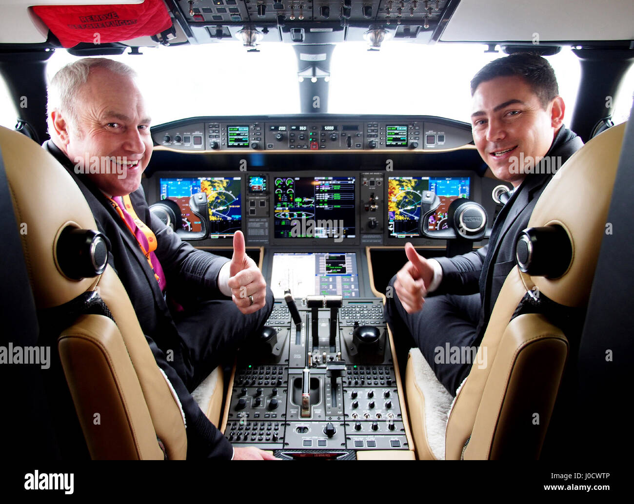 Shanghai. 11th Apr, 2017. Visitors pose for pictures within the cockpit ...