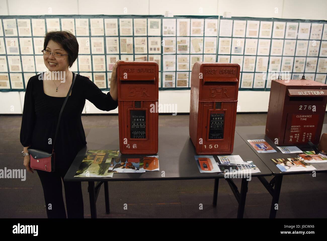 Hong Kong. 11th Apr, 2017. A woman poses for pictures with mailboxes of ...