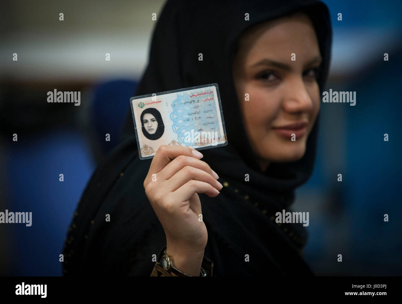 Tehran, Iran. 11th Apr, 2017. A woman shows her identification card as ...