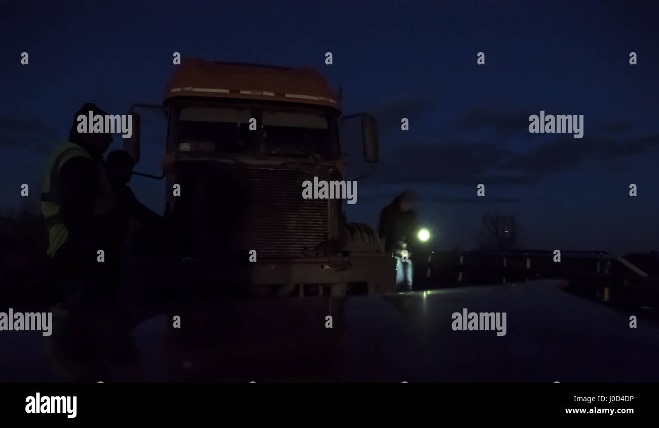 Mechanics repair in the field at the night the truck damaged during the ...