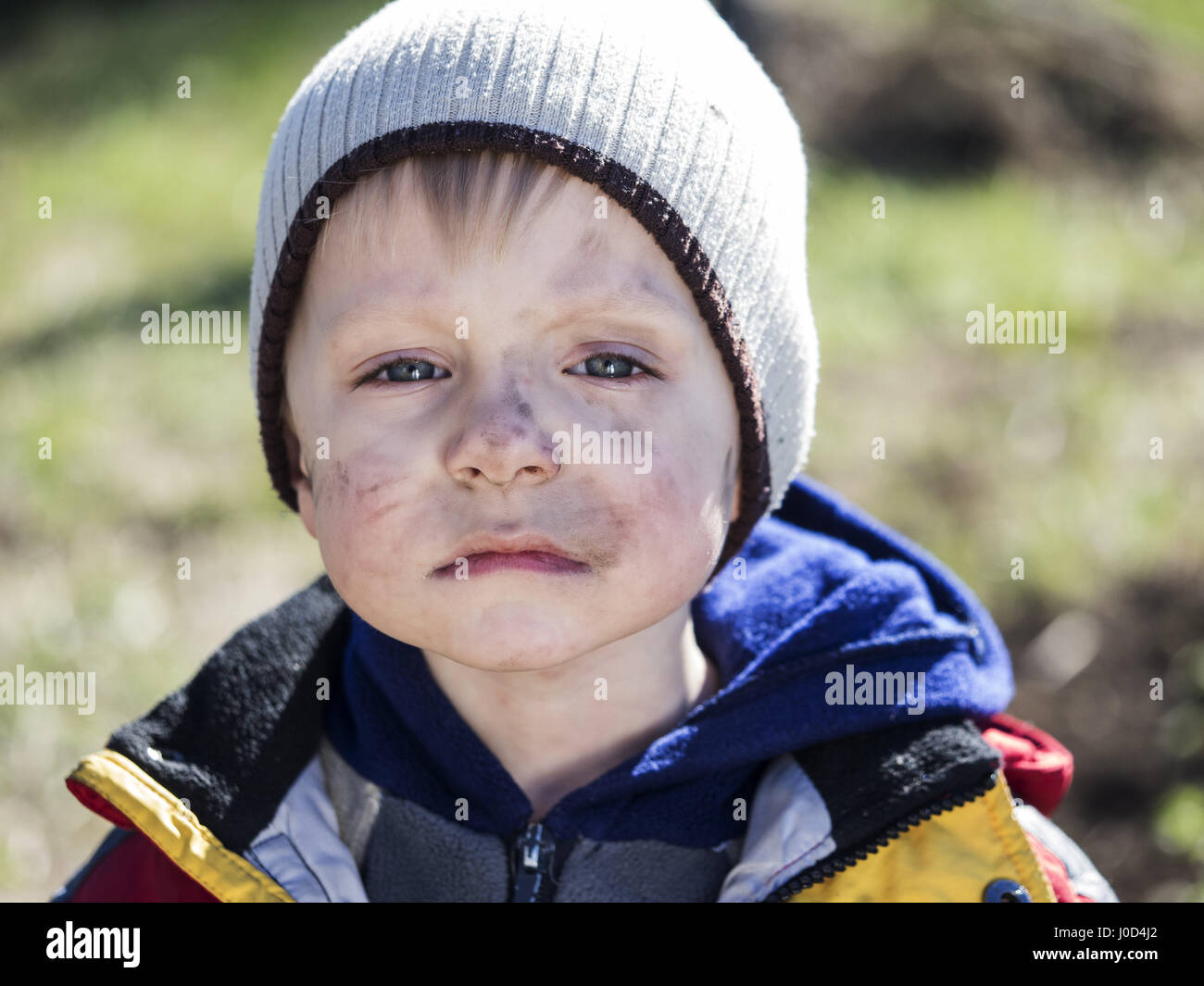 Portrait of a Caucasian boy smeared with soot. 9th Apr, 2017. Credit ...