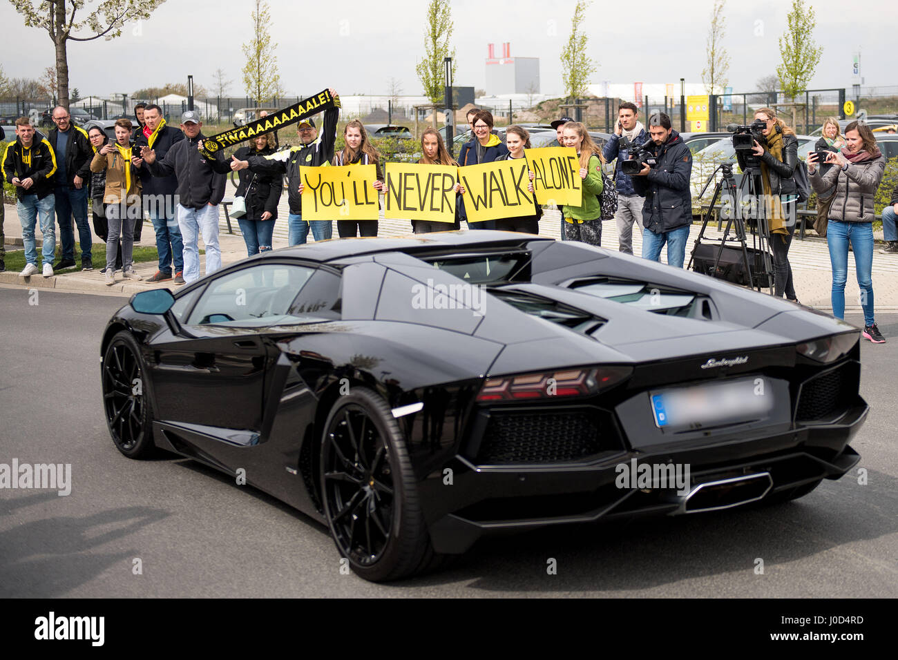 Dortmund, Germany. 12th Apr, 2017. Fans hold up signs reading 'You'll ...