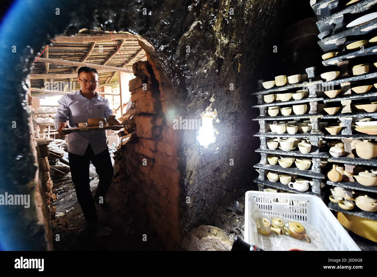 Dehua. 10th Apr, 2017. Ceramics enthusiast Chen Tiangui puts unfinished ...