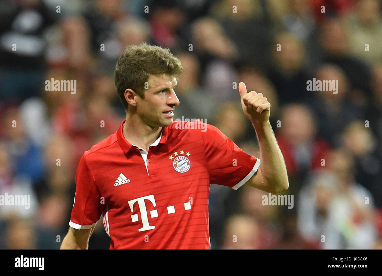 Munich's Thomas Mueller gives the thumbs up during the first leg of the ...
