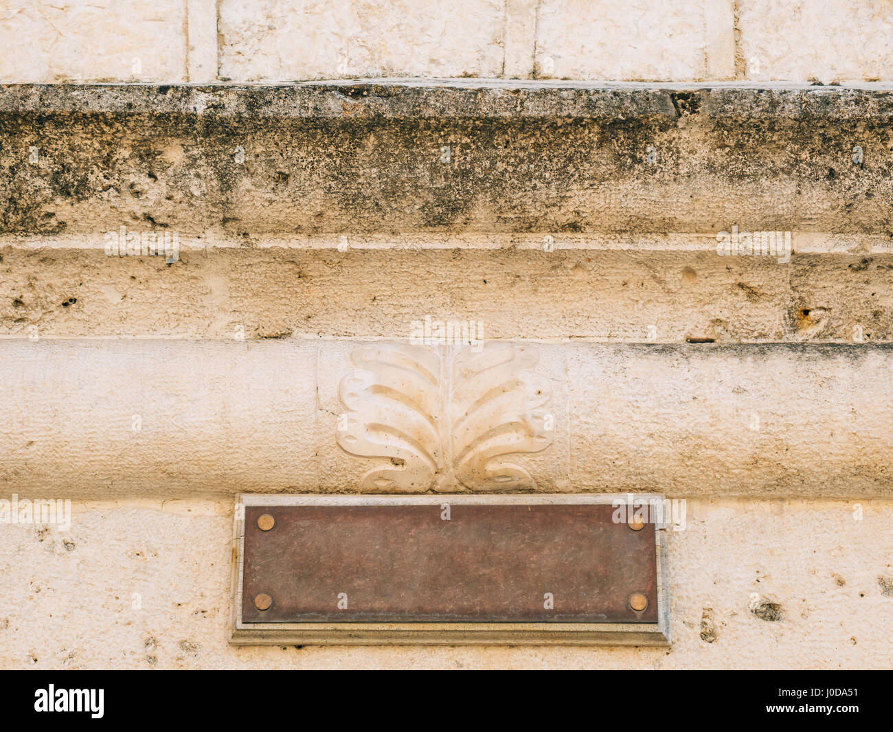 Board for inscriptions on the wall of a building Stock Photo - Alamy