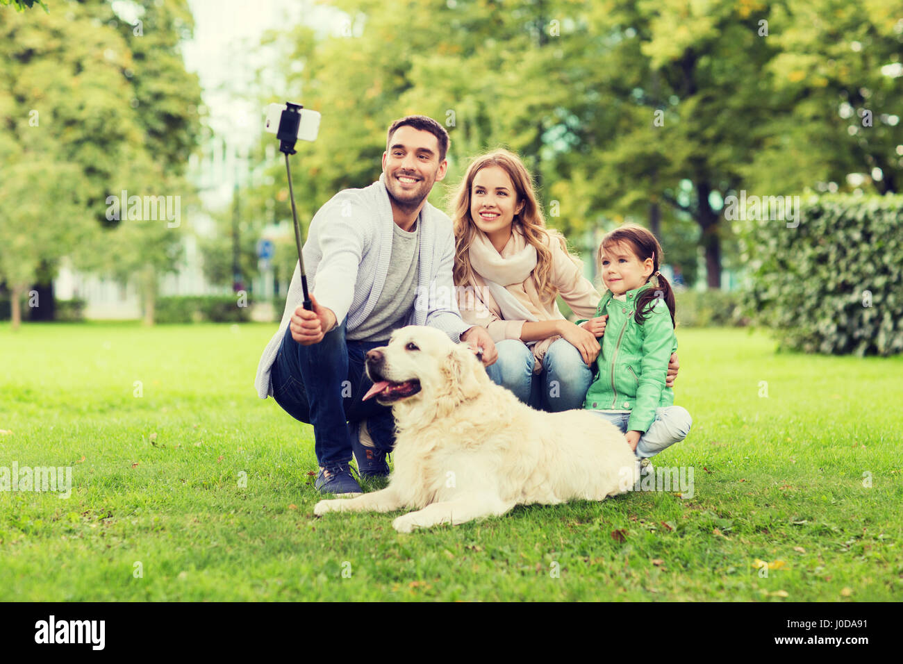 happy family with dog taking selfie by smartphone Stock Photo - Alamy