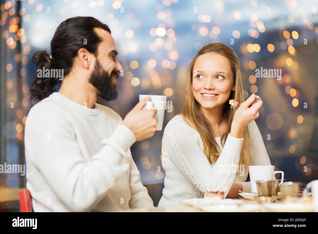 happy couple meeting and drinking tea or coffee Stock Photo - Alamy
