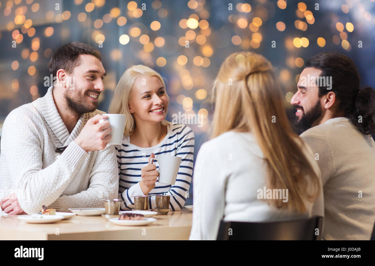 happy friends meeting and drinking tea Stock Photo - Alamy