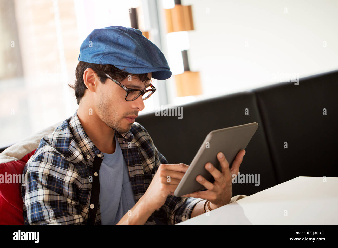 Male freelancer tablet sitting hi-res stock photography and images - Alamy