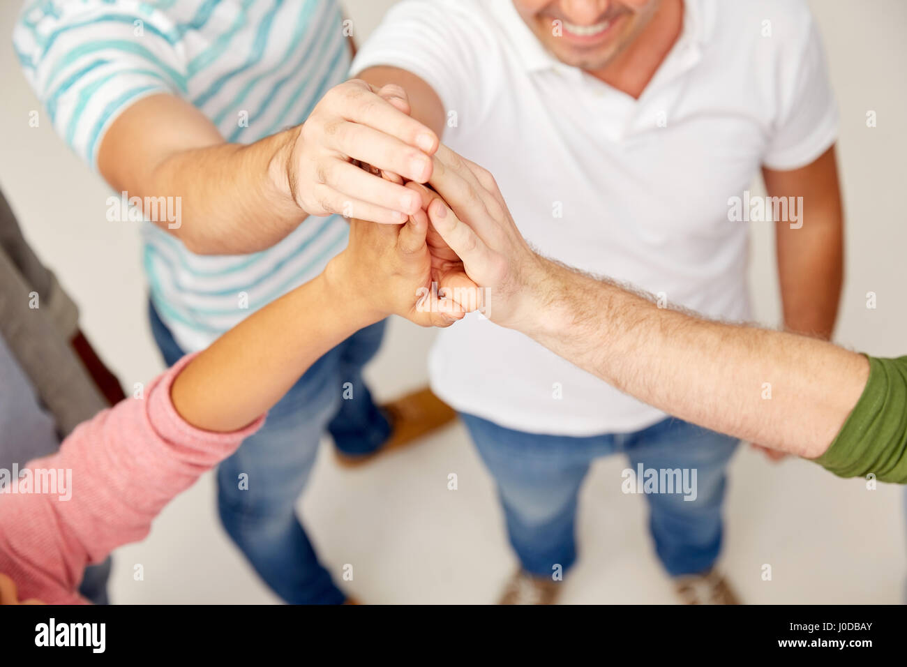 international group of people making high five Stock Photo - Alamy