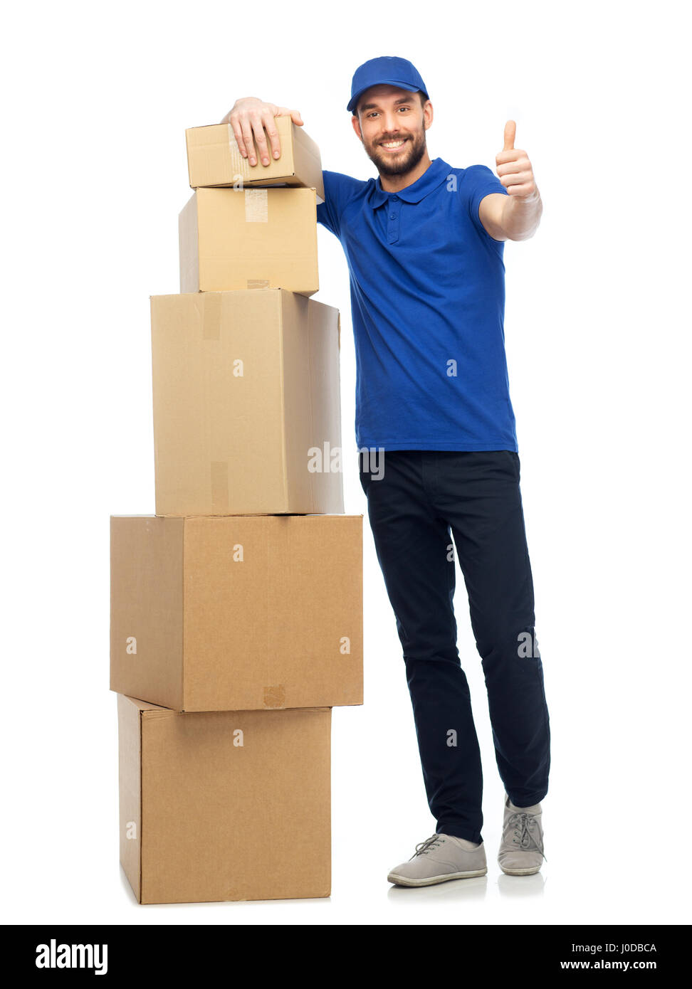 happy delivery man with boxes showing thumbs up Stock Photo - Alamy
