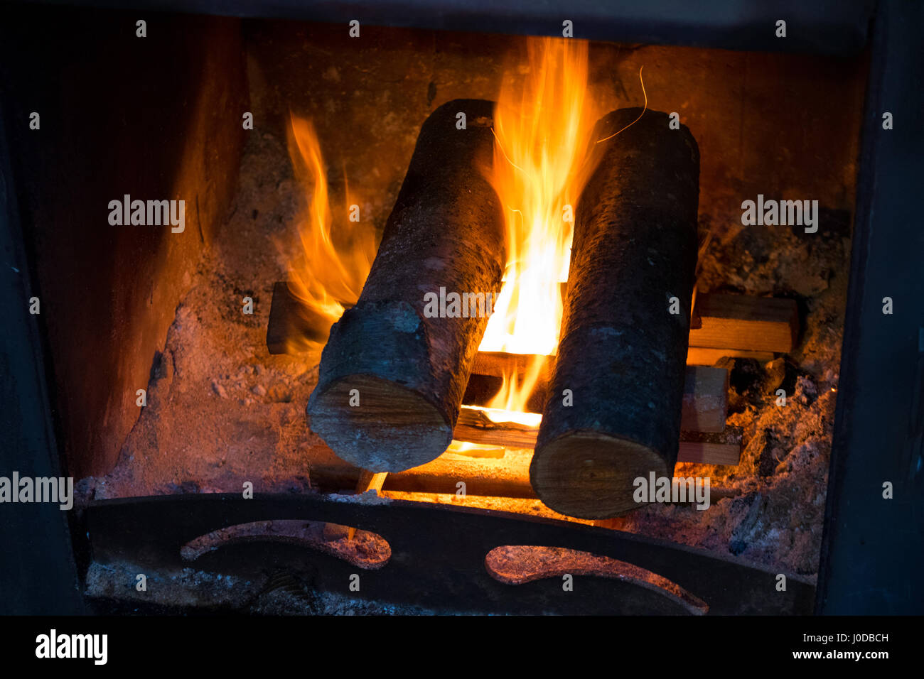 bright flame of fire burns in a fireplace, flame at Stove Stock Photo ...