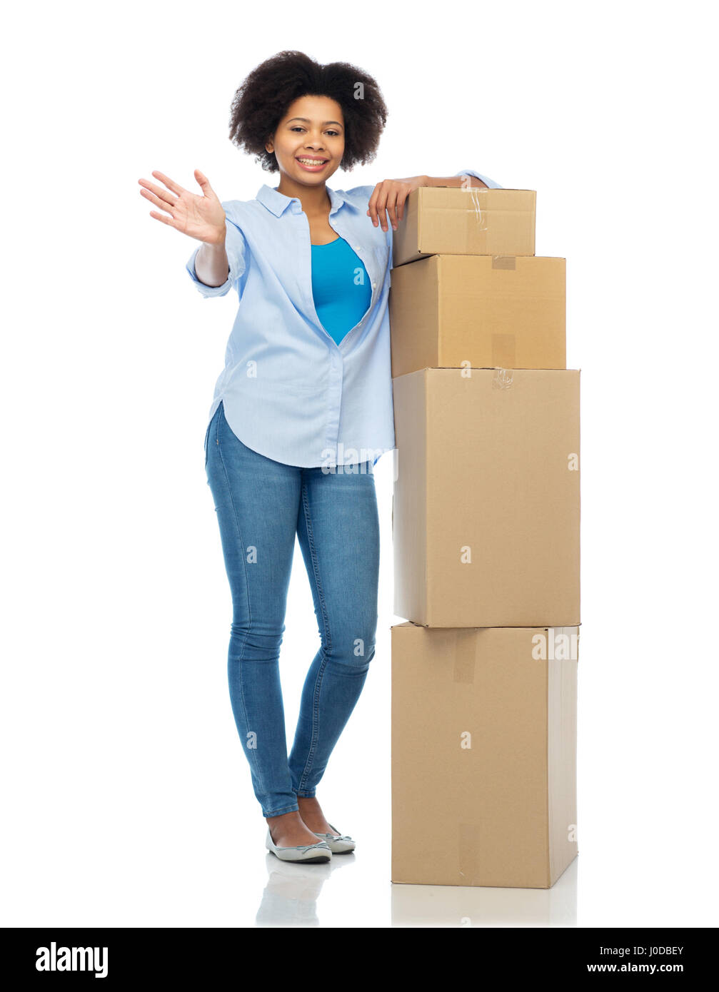 happy african woman with parcel boxes waving hand Stock Photo - Alamy
