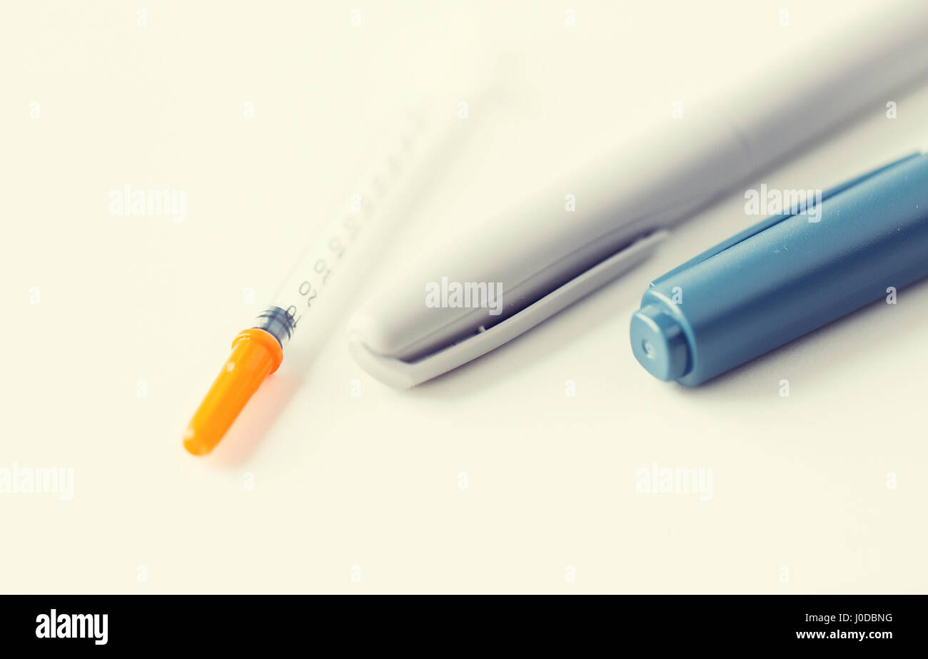 close up of injection pen and insulin syringe Stock Photo - Alamy