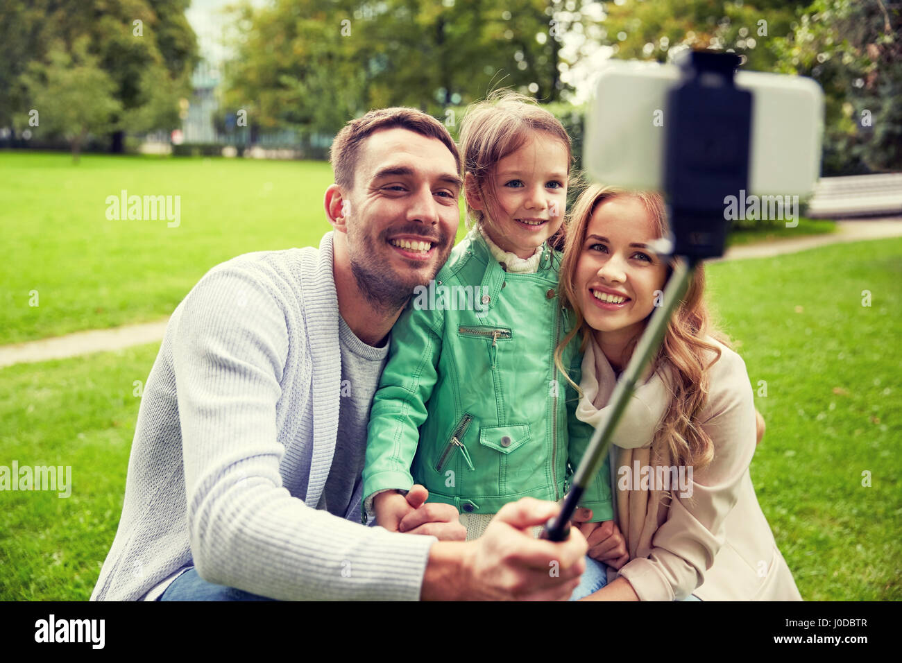 happy family taking selfie by smartphone outdoors Stock Photo - Alamy