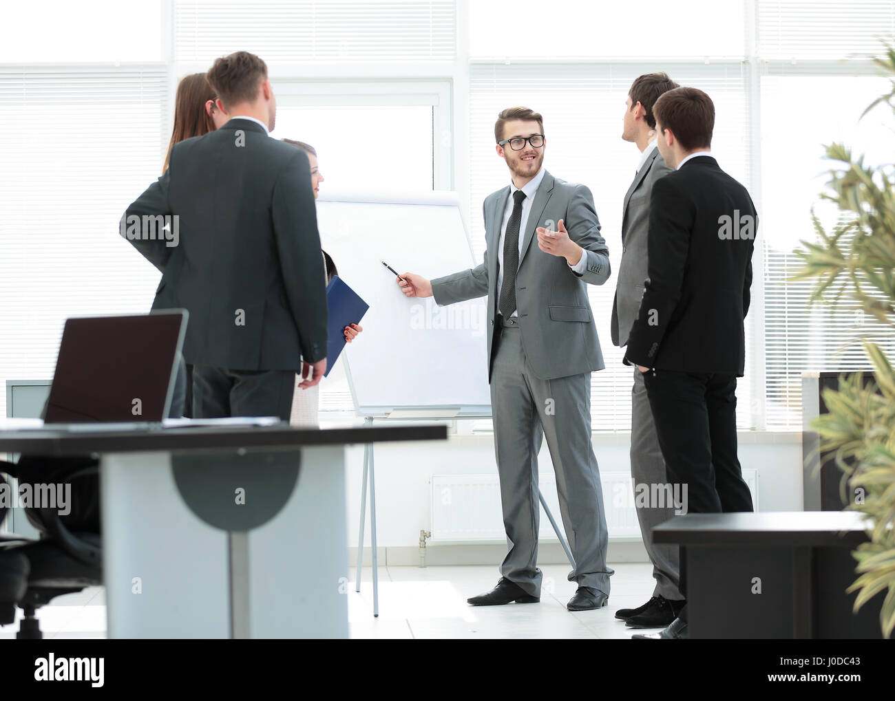 workplace with papers and an open laptop and business presentations in ...