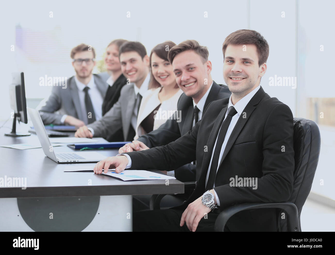 side view :the company's shareholders from a financial charts, sitting ...