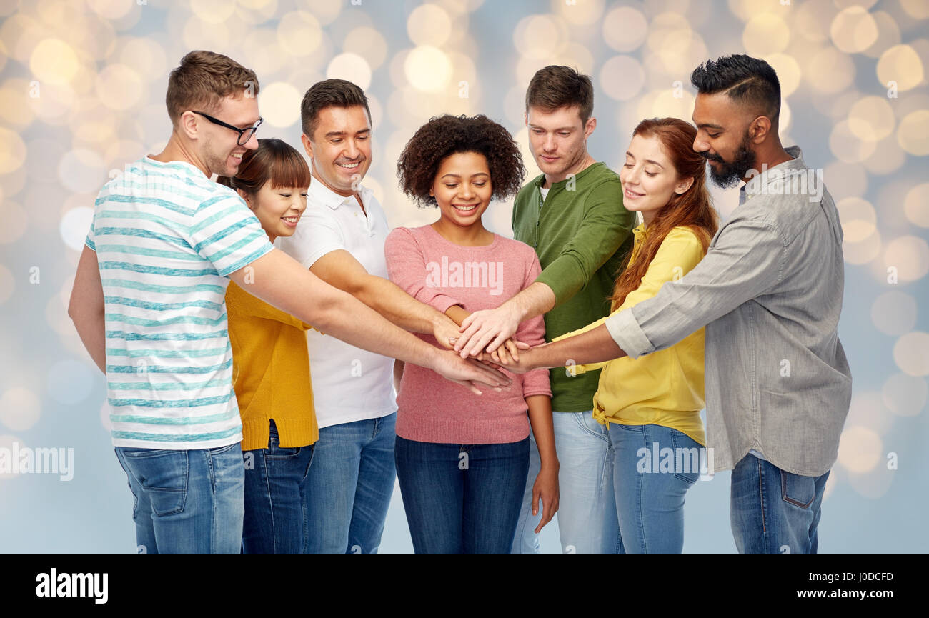 international group of happy people holding hands Stock Photo - Alamy