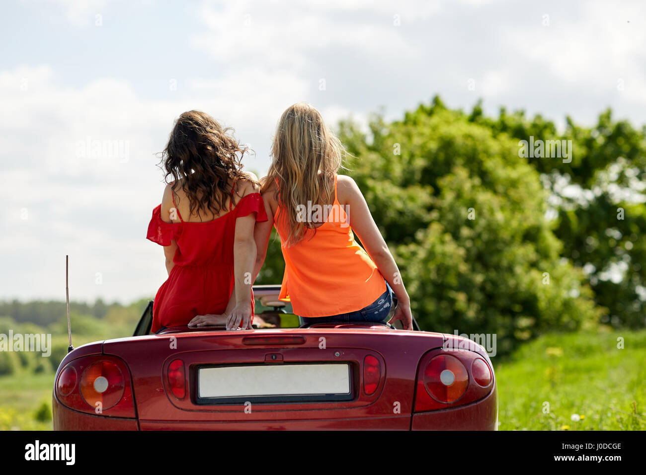 friends driving in convertible car at summer Stock Photo - Alamy