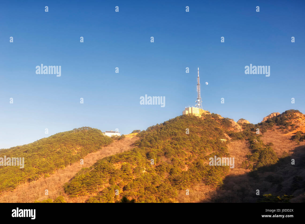 A waxing moon and radio tower on top of Bright peak in the Yellow ...
