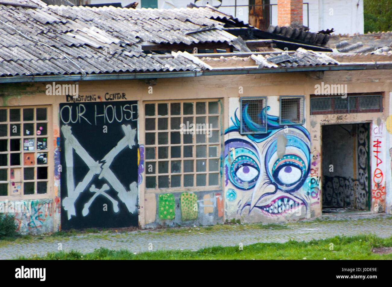 Wall of abandoned building, painted with graffiti Stock Photo - Alamy