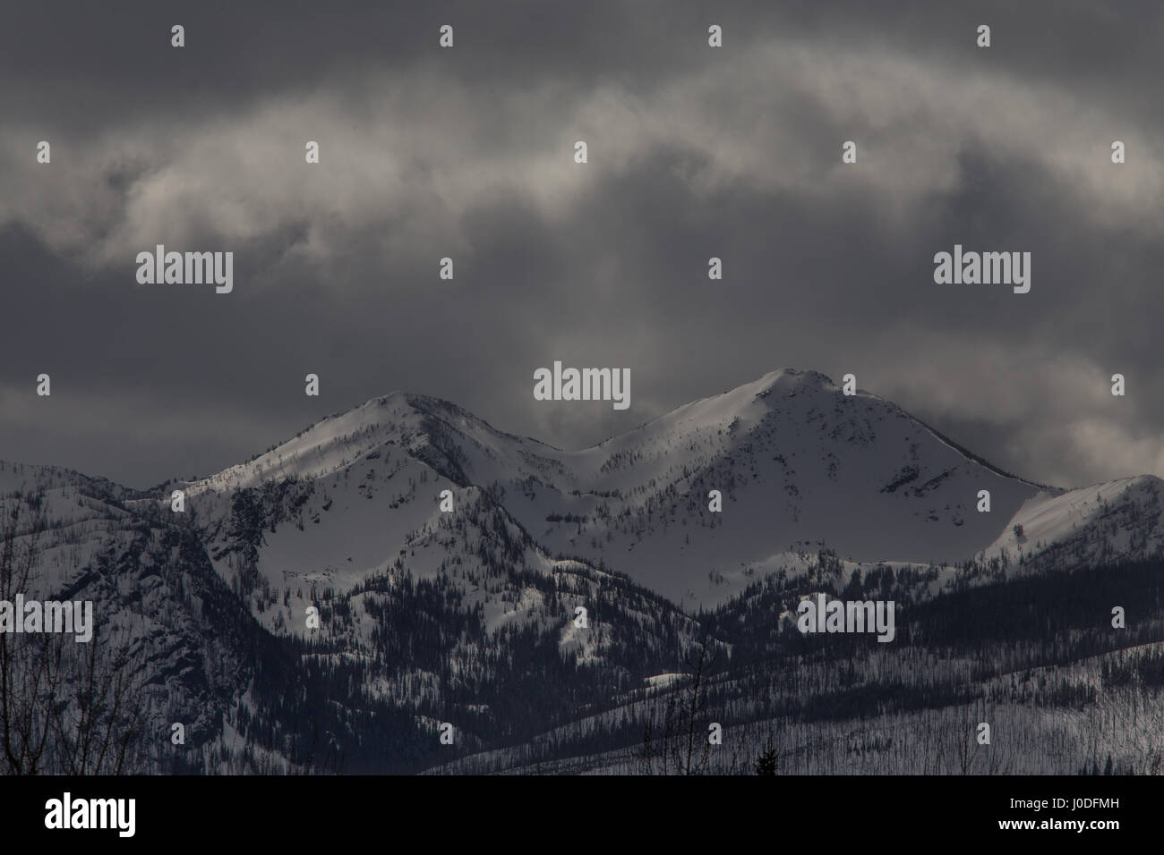 Dark and snowy mountains Stock Photo - Alamy