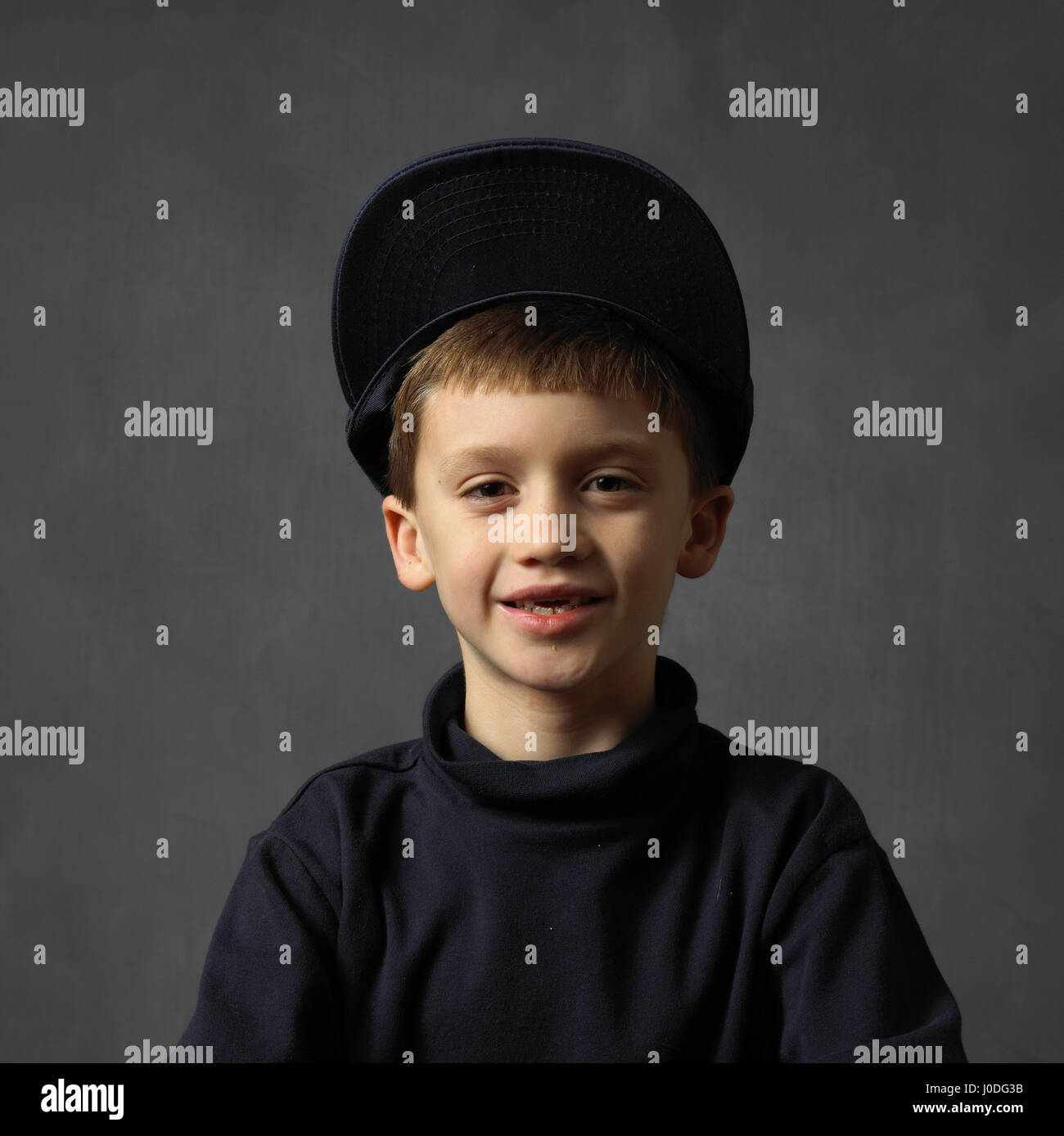 Young boy poses with assorted hats, straw, construction, hard, top ...