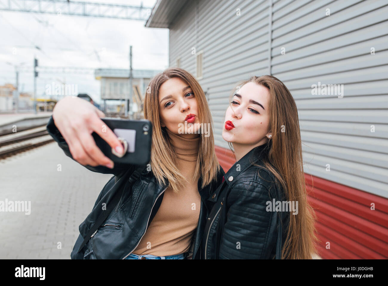 Two young girls taking selfie using smartphone Stock Photo - Alamy Two young girls taking selfie using smartphone Stock Photo - Alamy