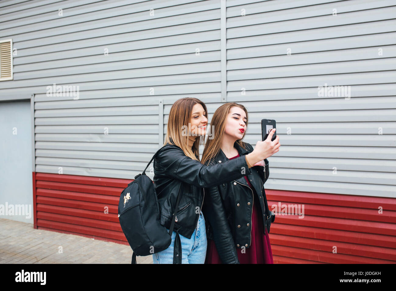 Two young girls taking selfie using smartphone Stock Photo - Alamy Two young girls taking selfie using smartphone Stock Photo - Alamy