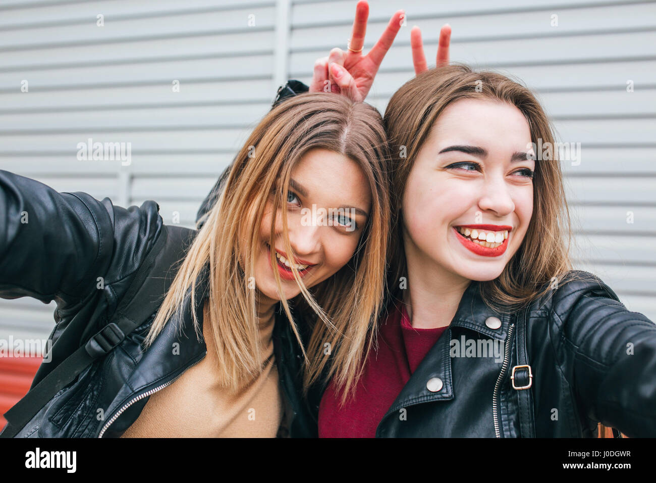 Two young girls taking selfie using smartphone Stock Photo - Alamy Two young girls taking selfie using smartphone Stock Photo - Alamy