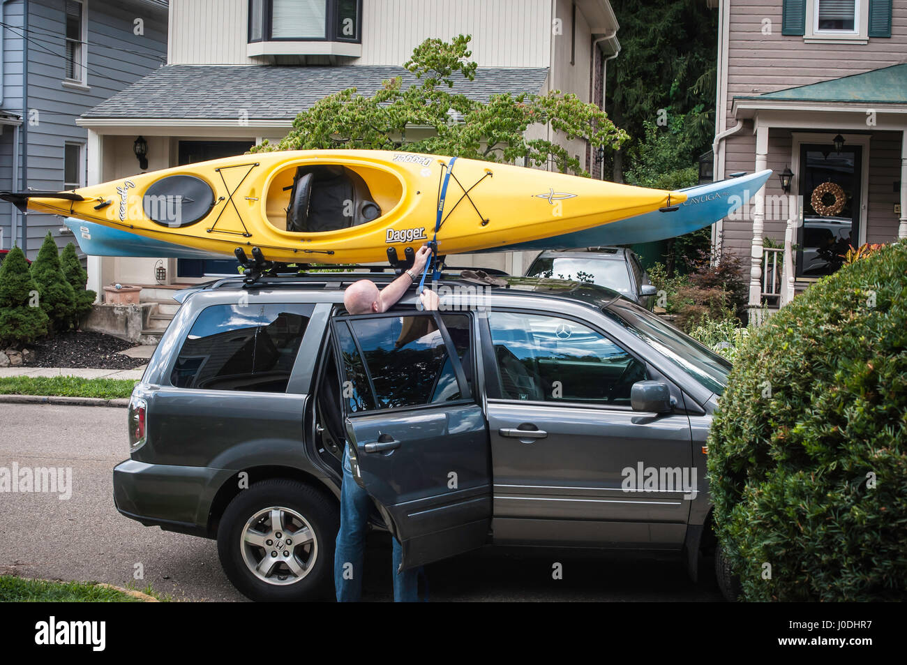 Family preparation for camping, kayaking Stock Photo - Alamy