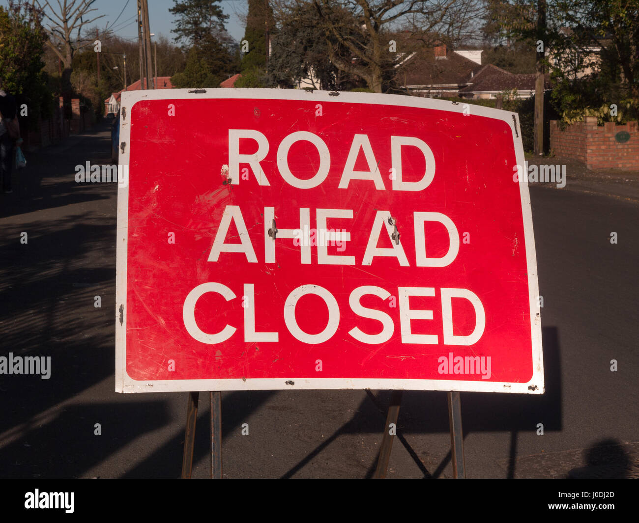 A a big red and white road closed ahead sign Stock Photo - Alamy