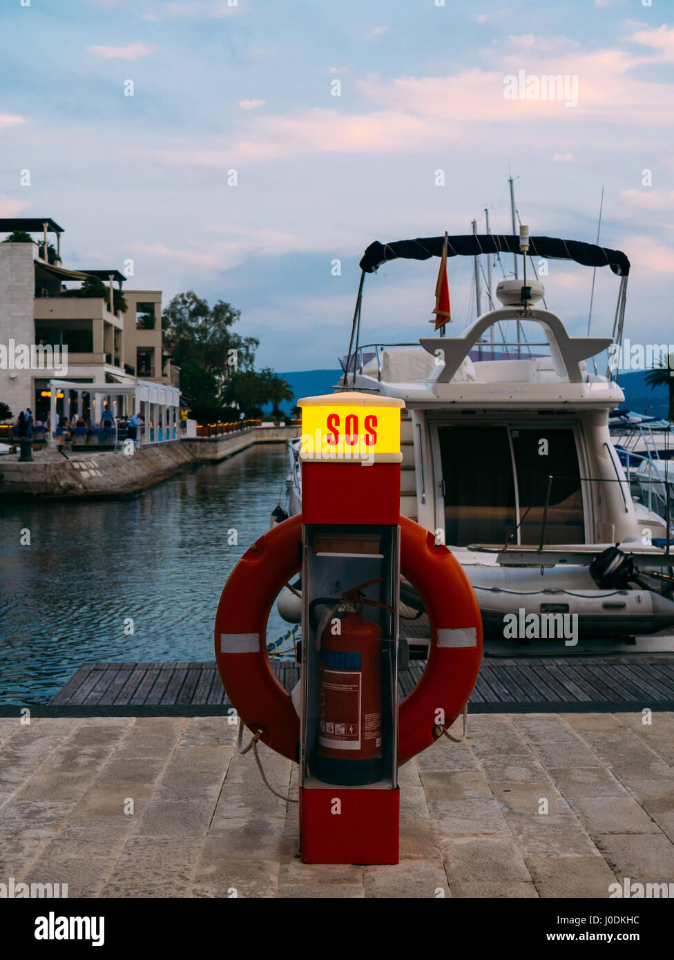 Lifebuoy in the marina for yachts. Red circle on the boat dock Stock ...