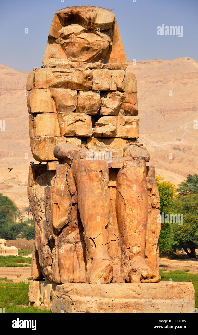 Colossi of Memnon are two gigantic stone statues depicting Pharaoh ...