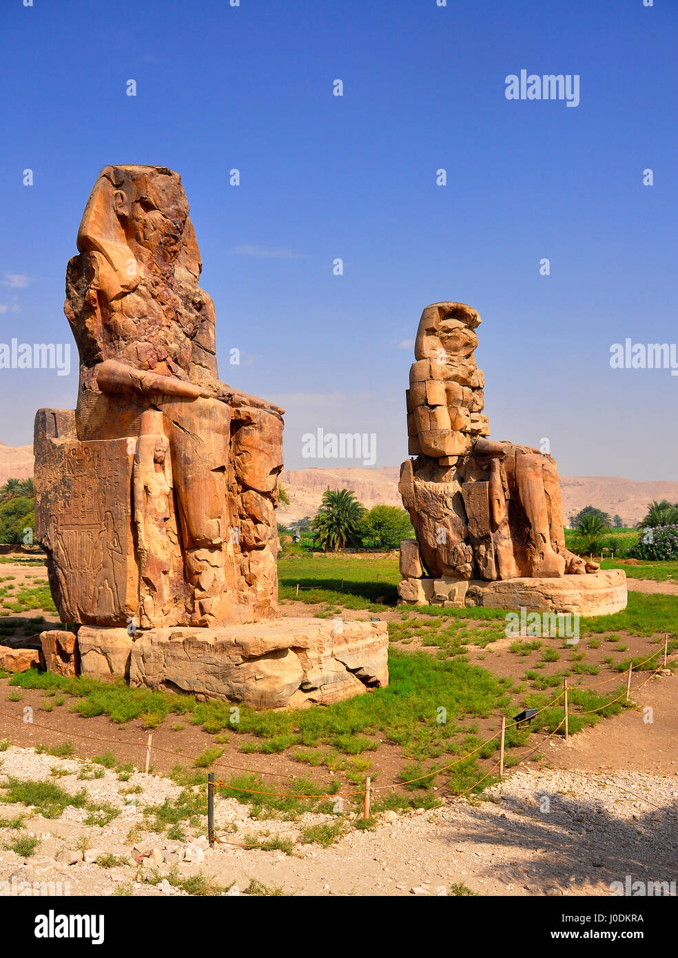 Colossi of Memnon are two gigantic stone statues depicting Pharaoh ...