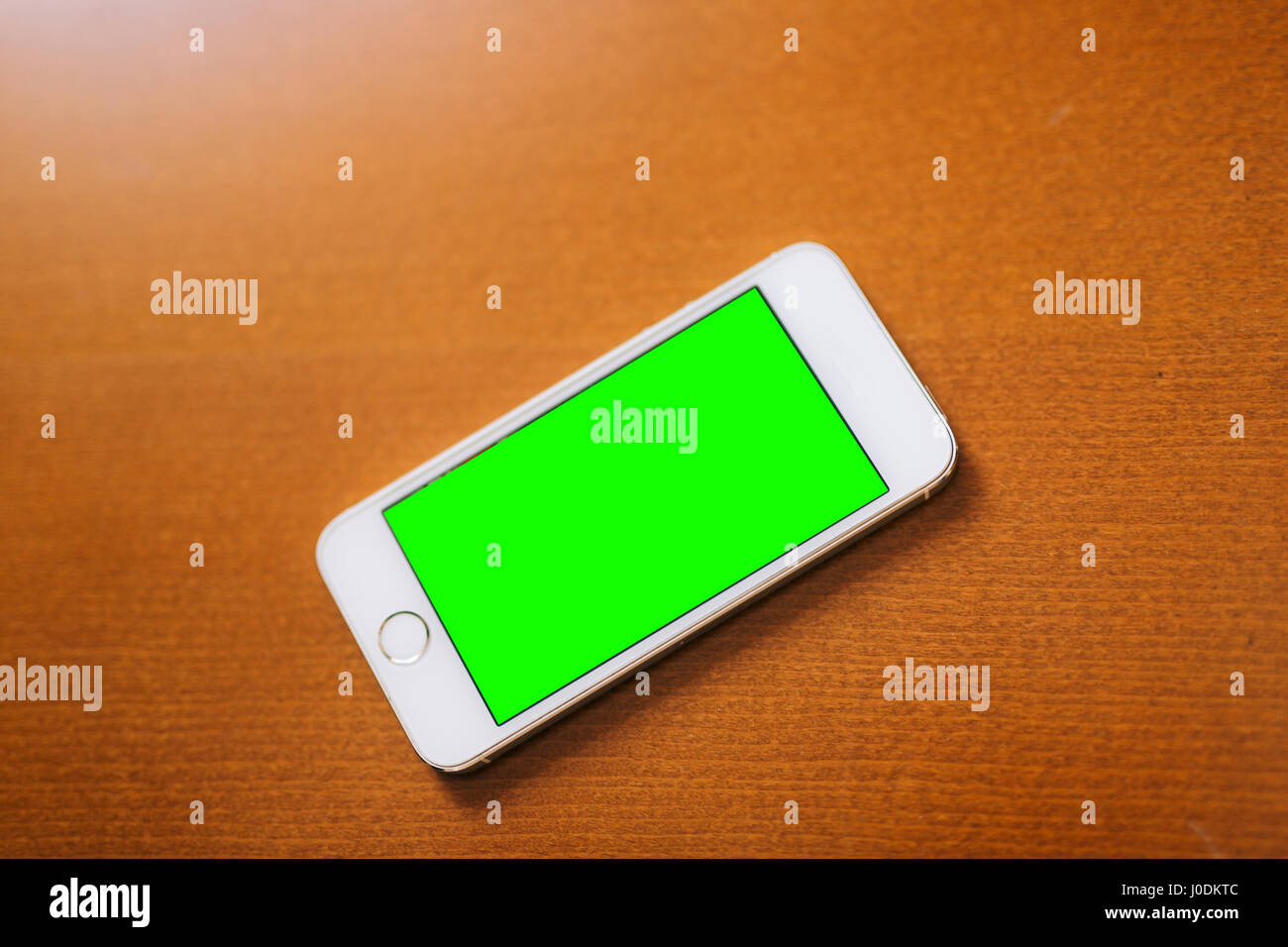 White phone green screen Stock Photo - Alamy