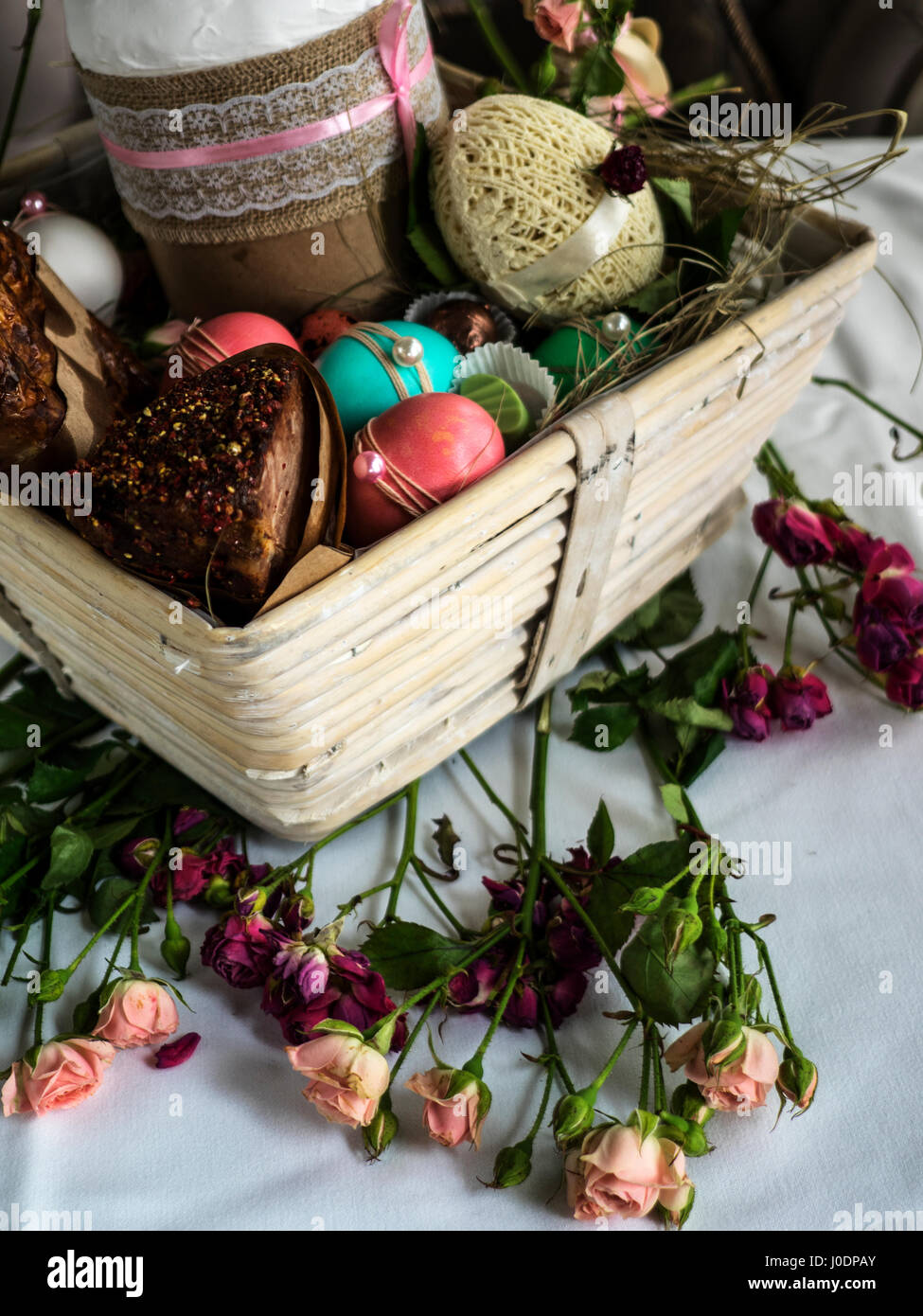 Easter basket for ceremony witn different food: Easter cake, colored ...
