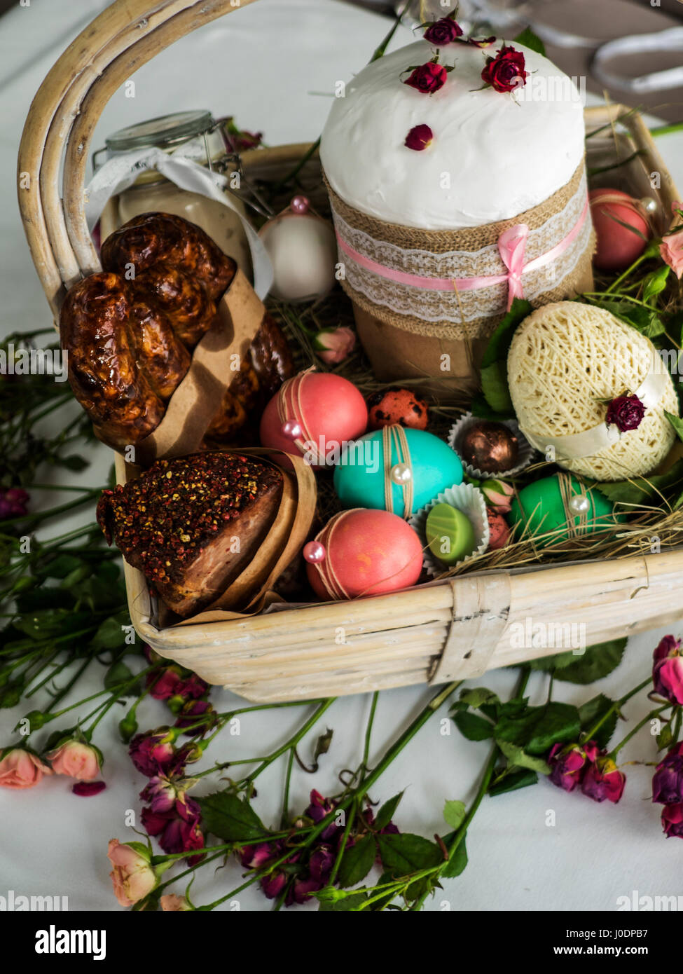 Easter basket for ceremony witn different food: Easter cake, colored ...