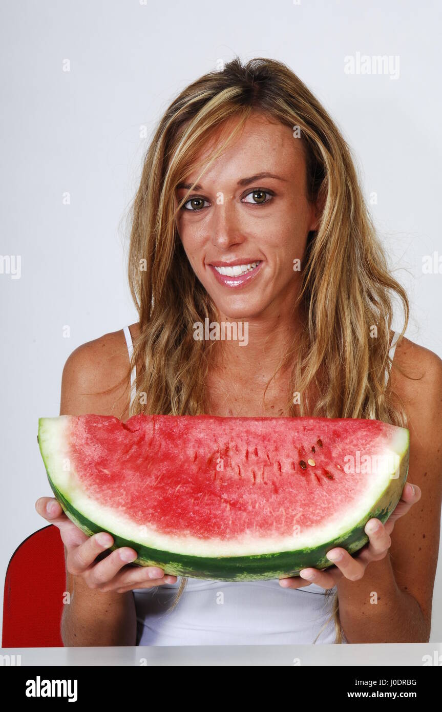 A woman eating a watermelon Stock Photo - Alamy