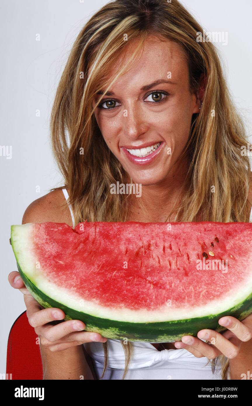 A woman eating a watermelon Stock Photo - Alamy