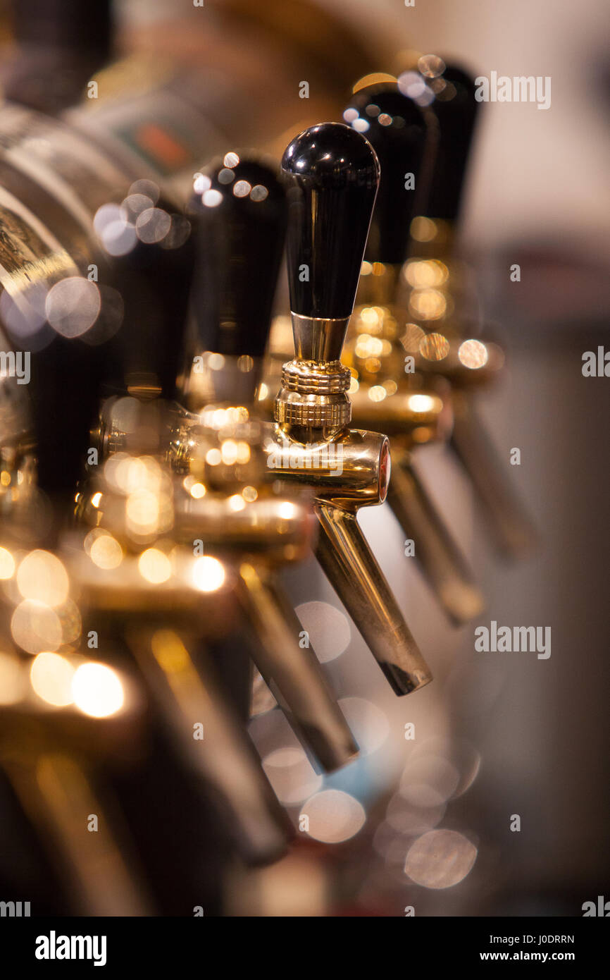 Lot of vintage Golden beer taps at the bar Stock Photo - Alamy