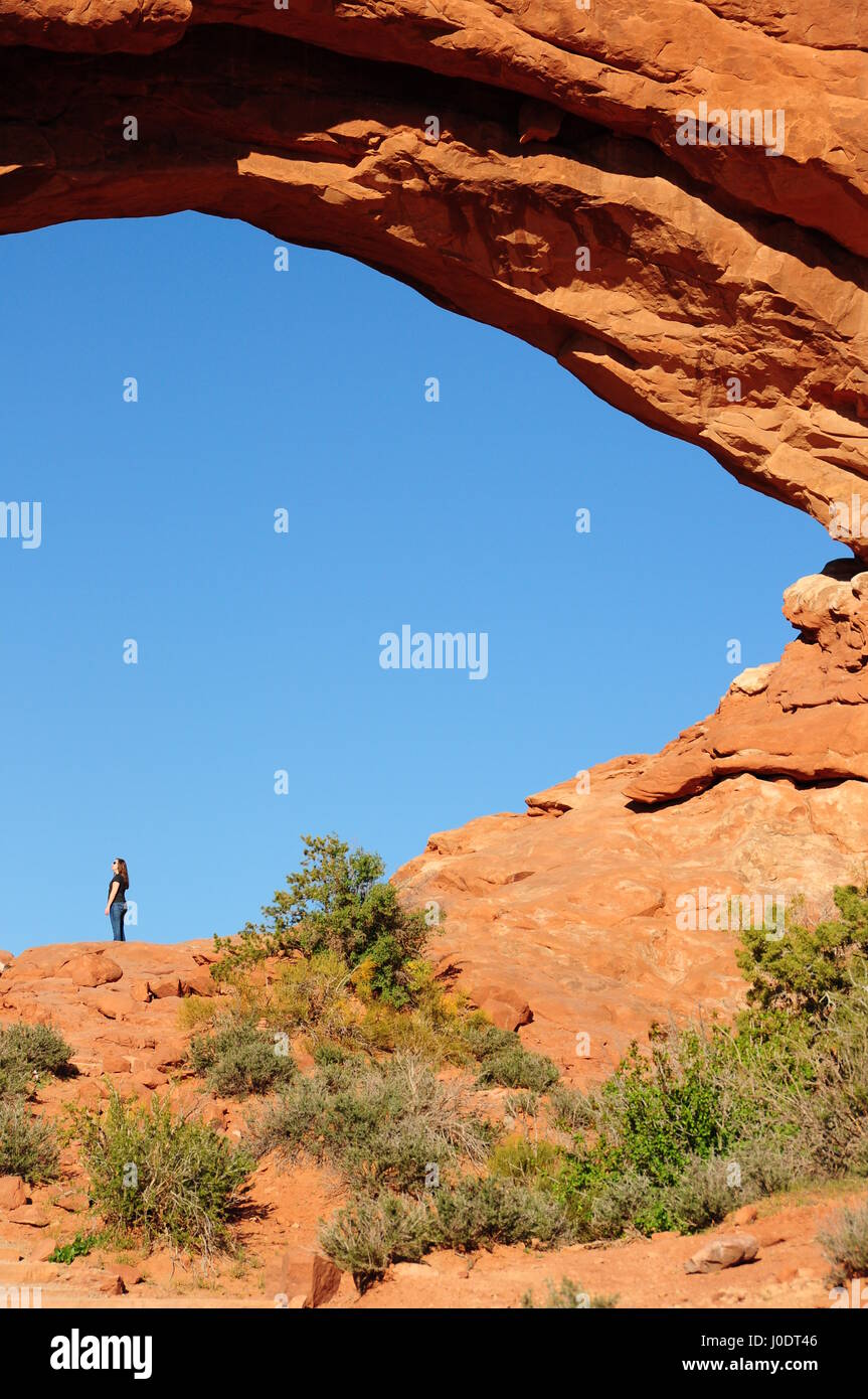 majestic red stone arches appear massive in size at Arches National ...