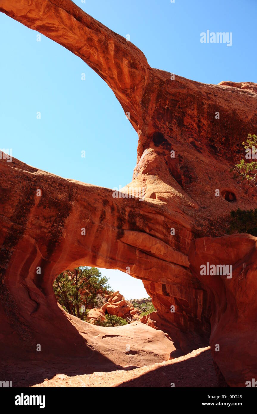 majestic red stone arches appear massive in size at Arches National ...