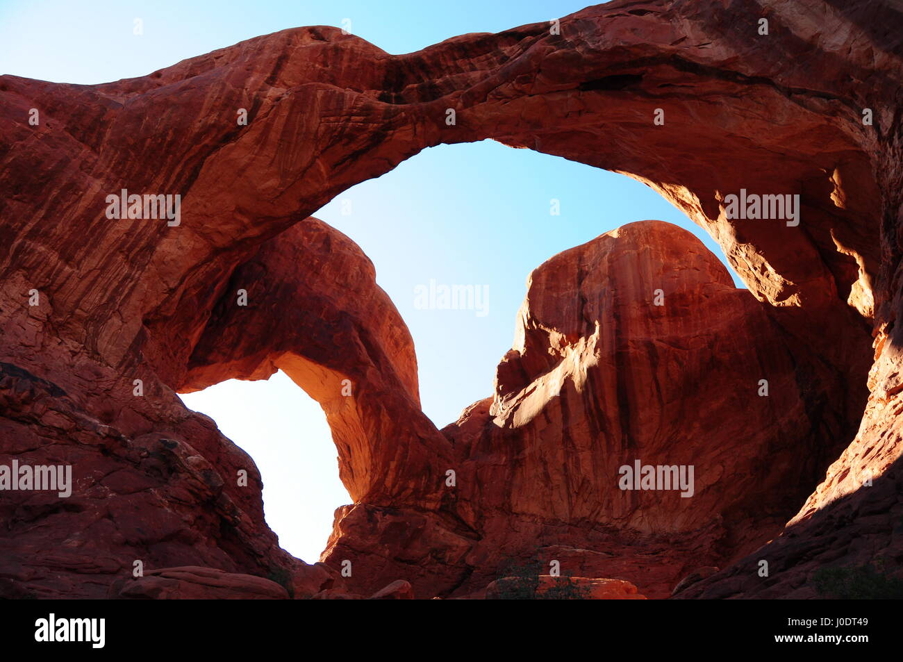 majestic red stone arches appear massive in size at Arches National ...