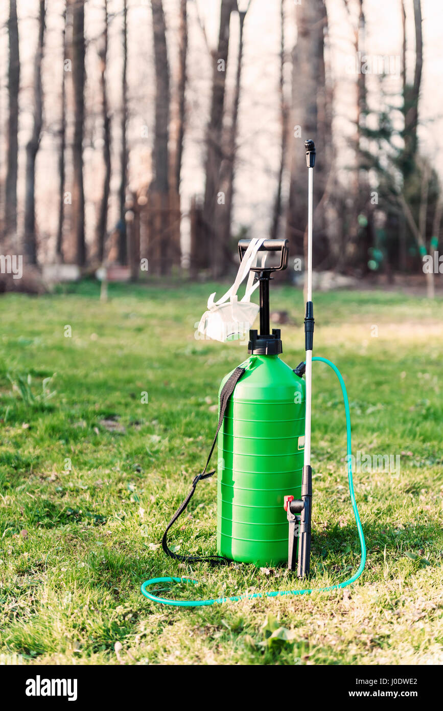 green sprayer on spring garden Stock Photo - Alamy