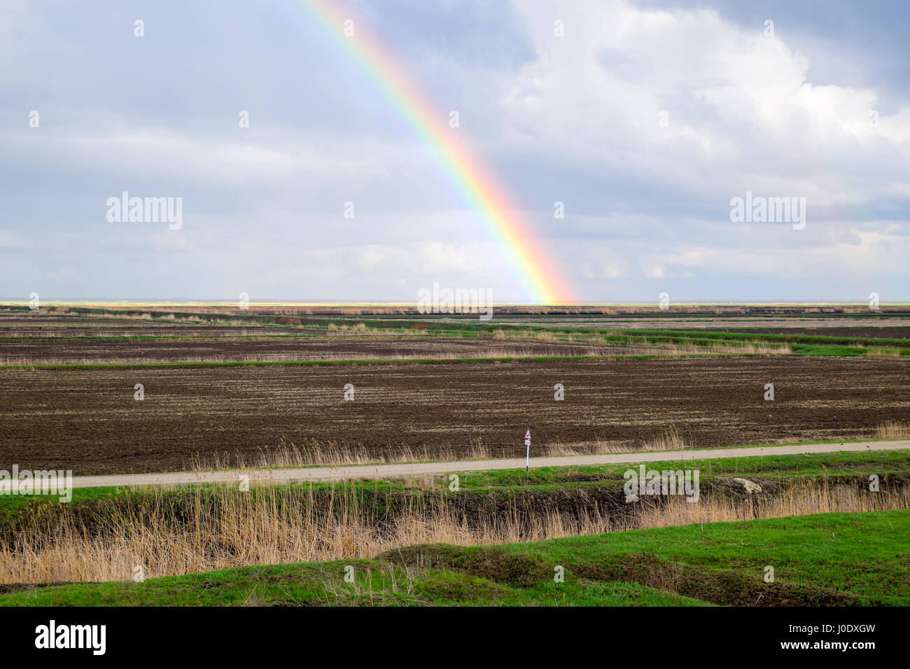 Rainbow, a view of the landscape in the field. Formation of the rainbow ...