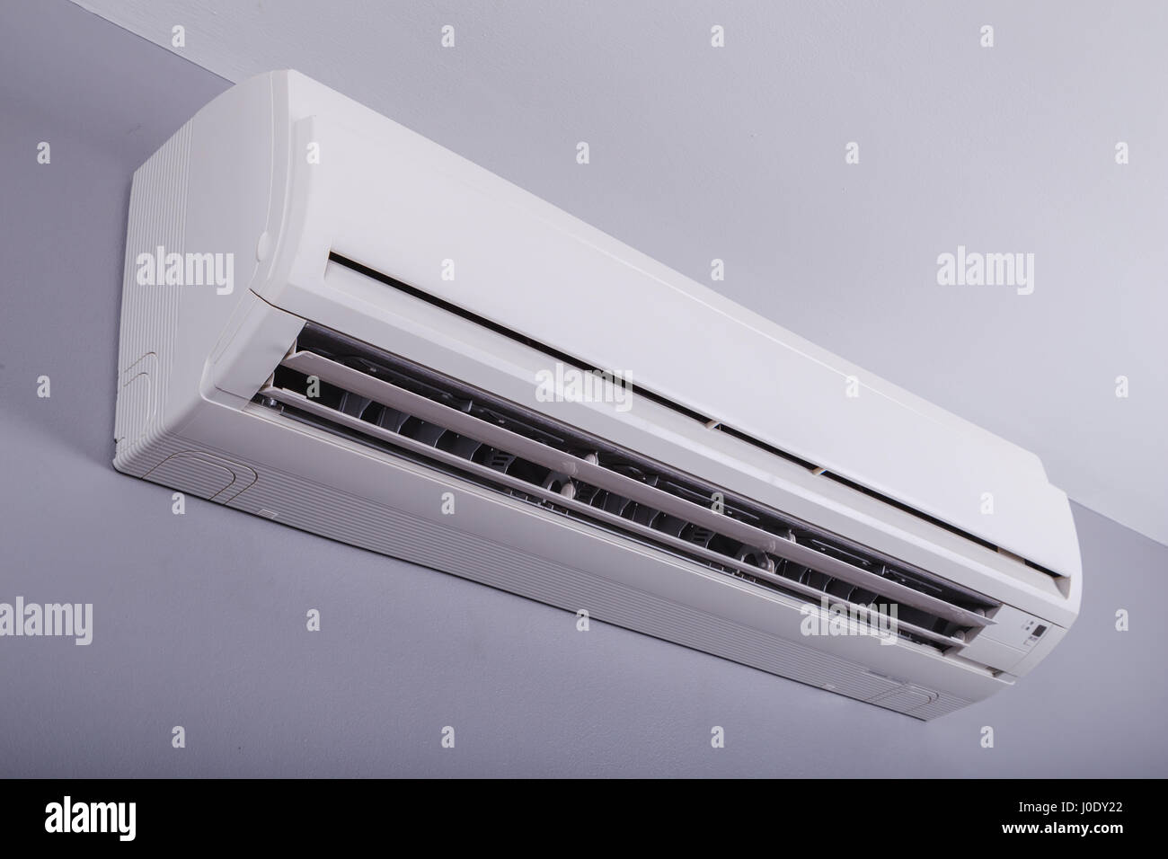 Split air conditioner on wall hi-res stock photography and images - Alamy