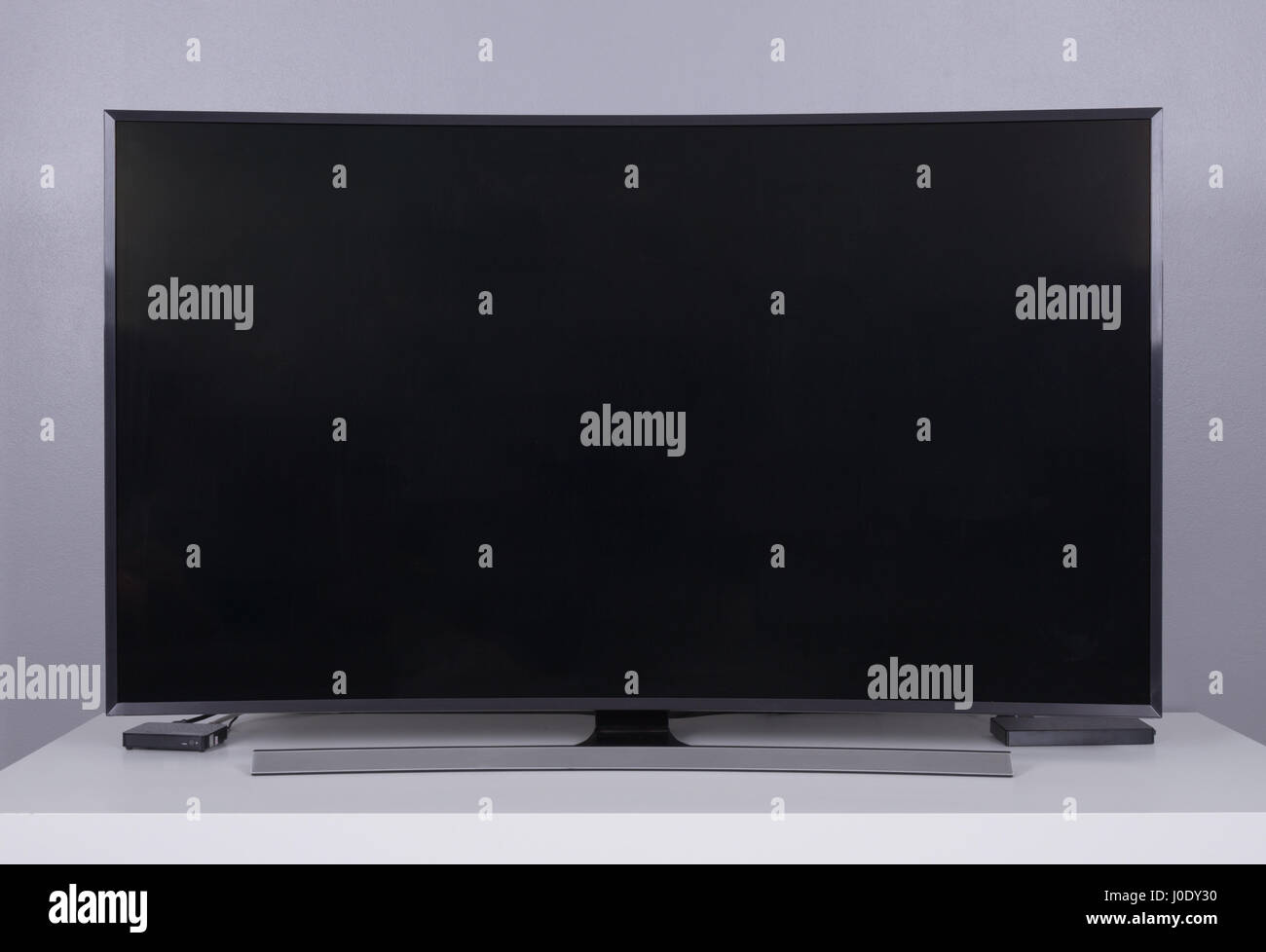 LED TV on white stand Stock Photo - Alamy