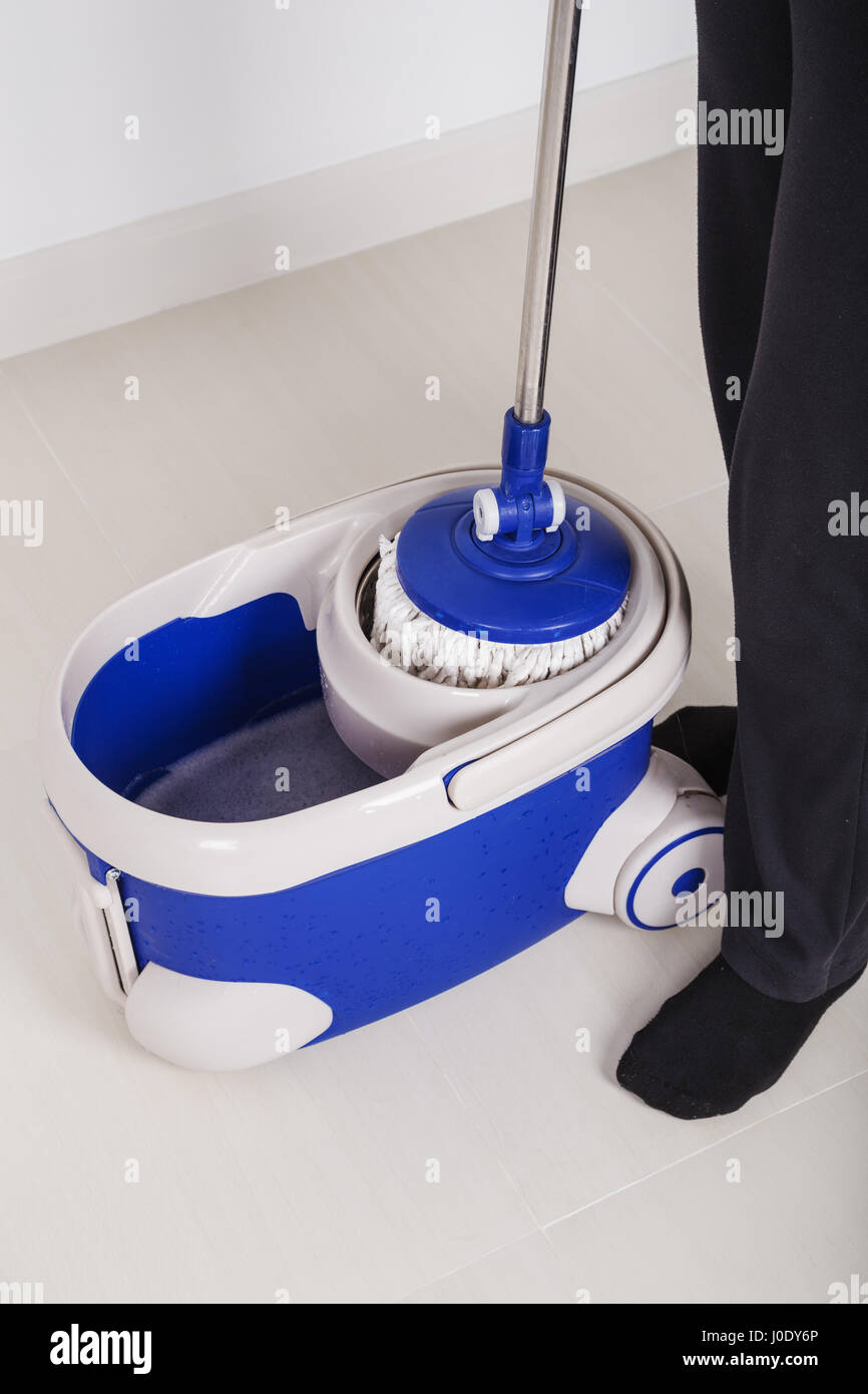 woman legs with mop and bucket cleaning floor at home Stock Photo - Alamy