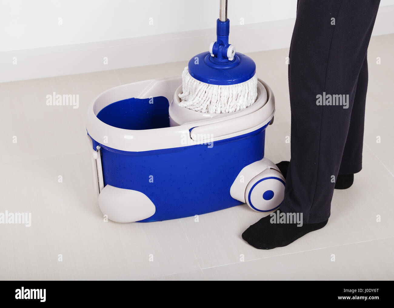 woman legs with mop and bucket cleaning floor at home Stock Photo - Alamy